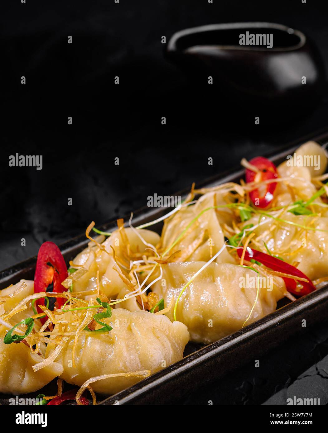 Gourmet asian dumplings on elegant serving platter Stock Photo - Alamy