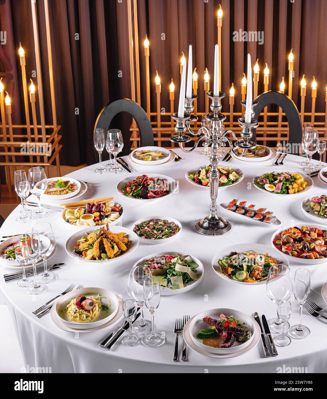 Elegant dining table set for a gourmet banquet Stock Photo - Alamy