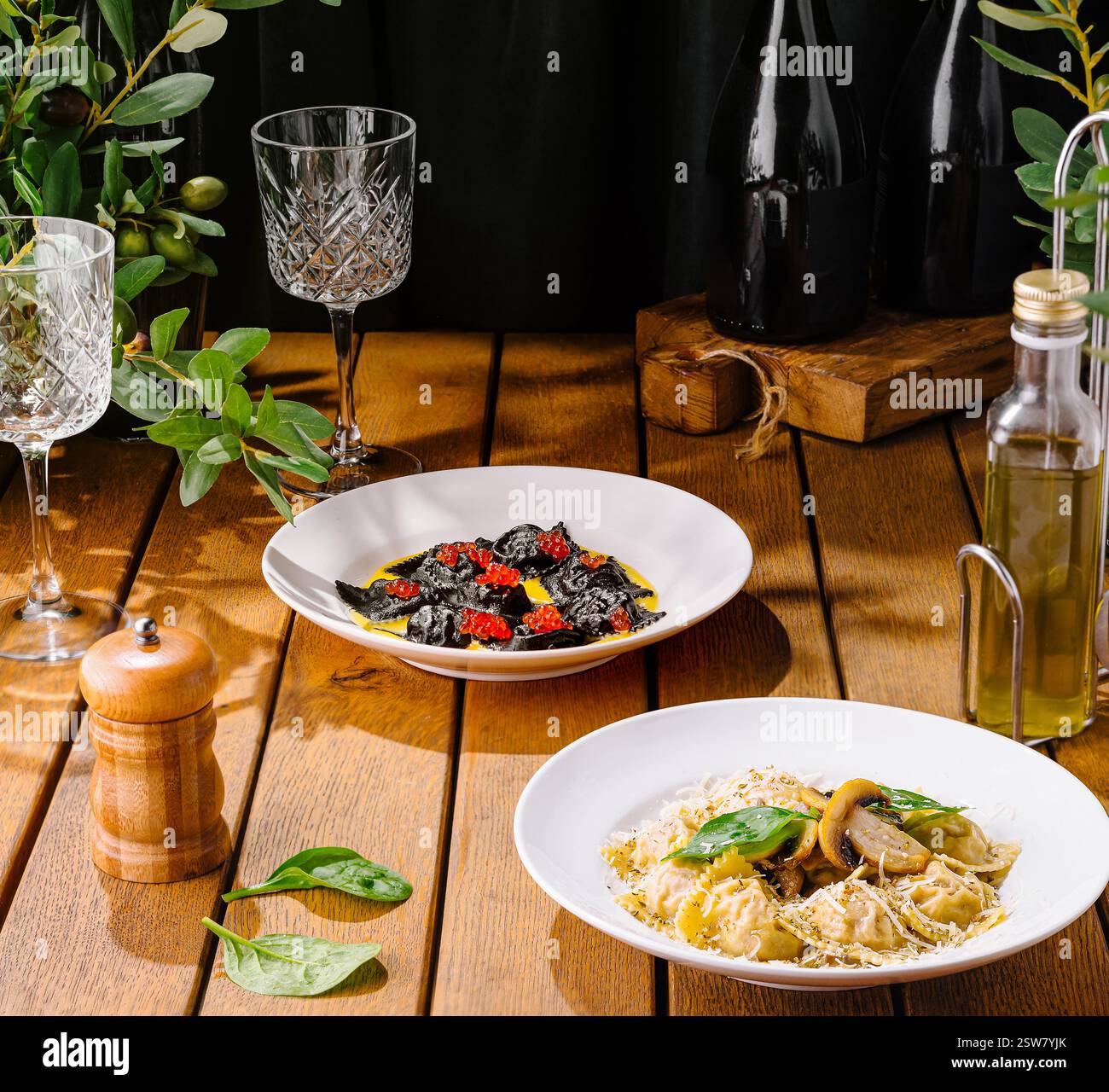 Three types of pasta served elegantly on white plates, ready for a fine ...