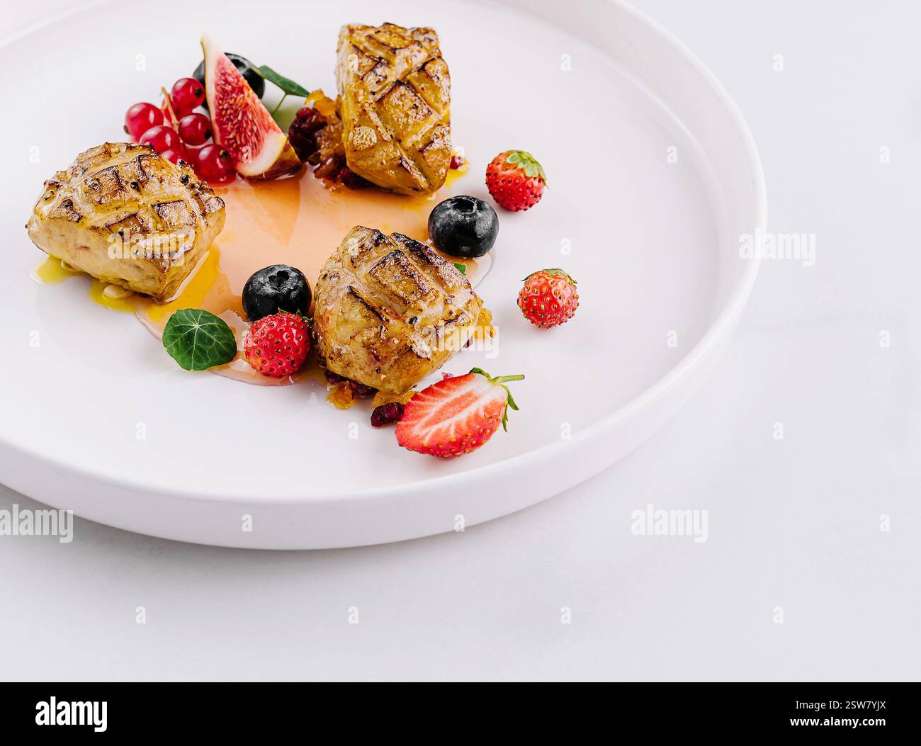 Elegant dessert presentation on white plate Stock Photo - Alamy