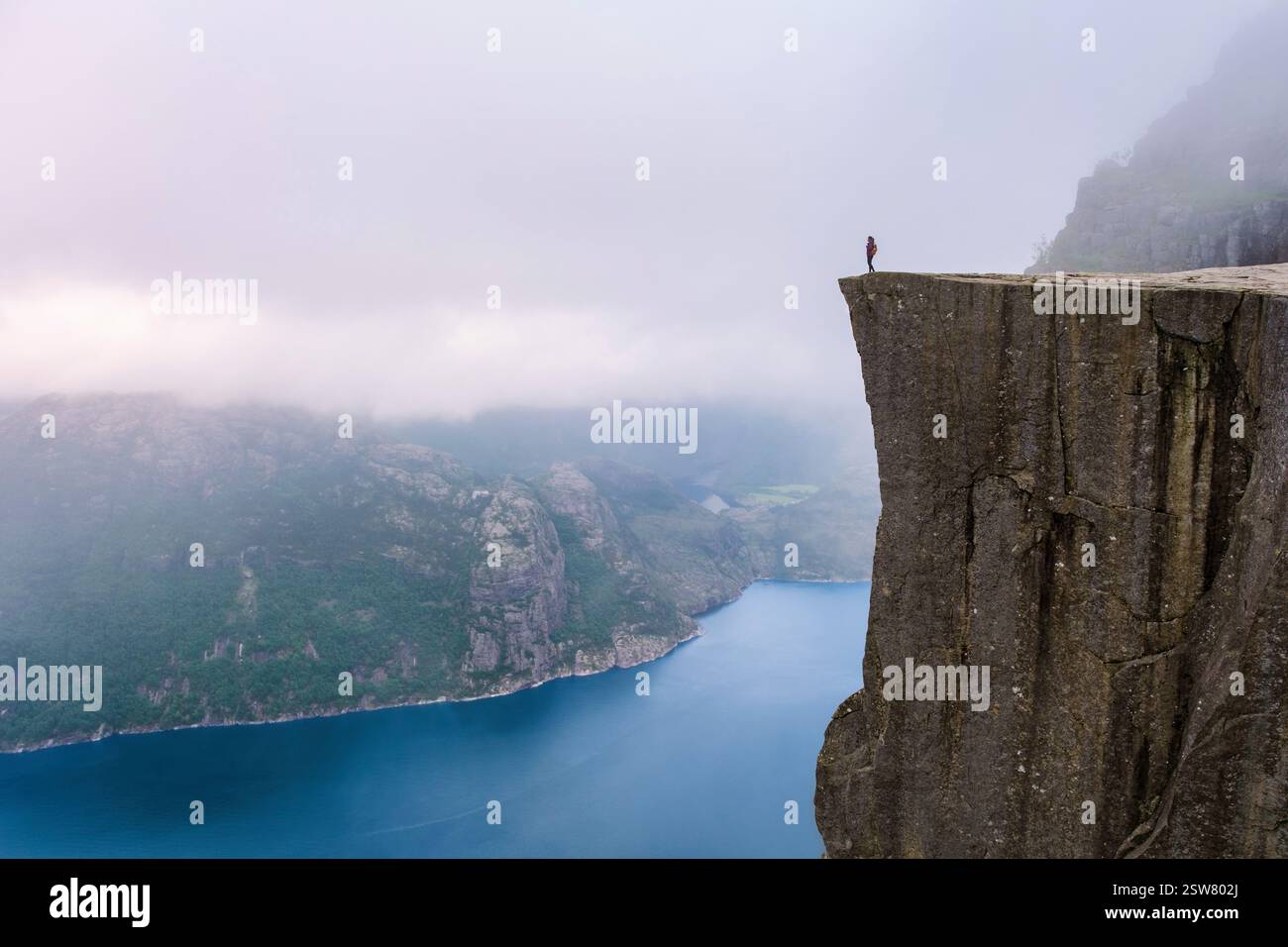 Lone figure stands on rocky hi-res stock photography and images - Alamy