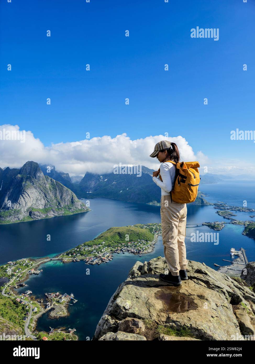 Adventurer Captivated by Scenic Views in Norway's Majestic Lofoten ...