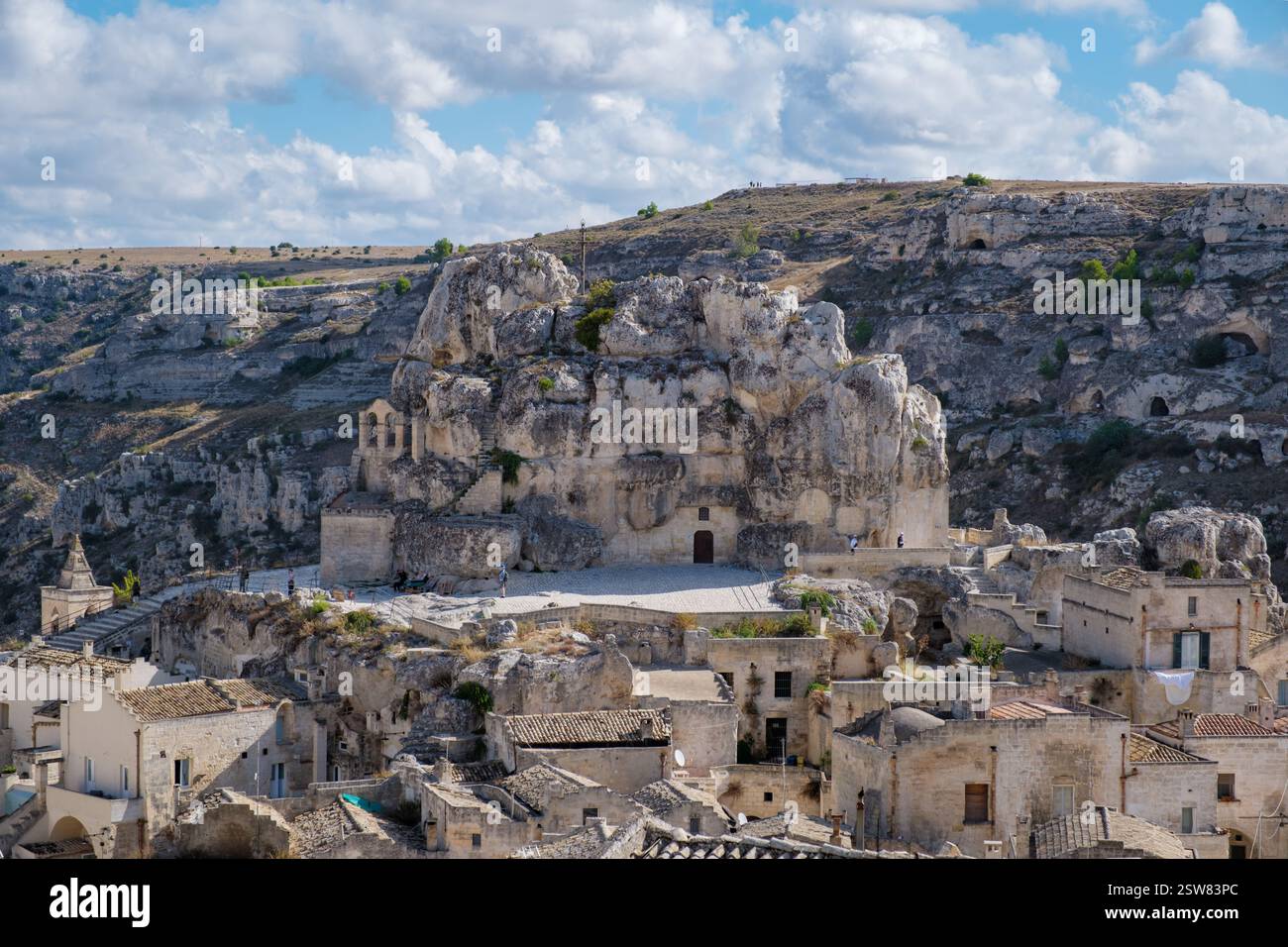 Explore the ancient stone dwellings of Matera, Puglia, Italy under a ...