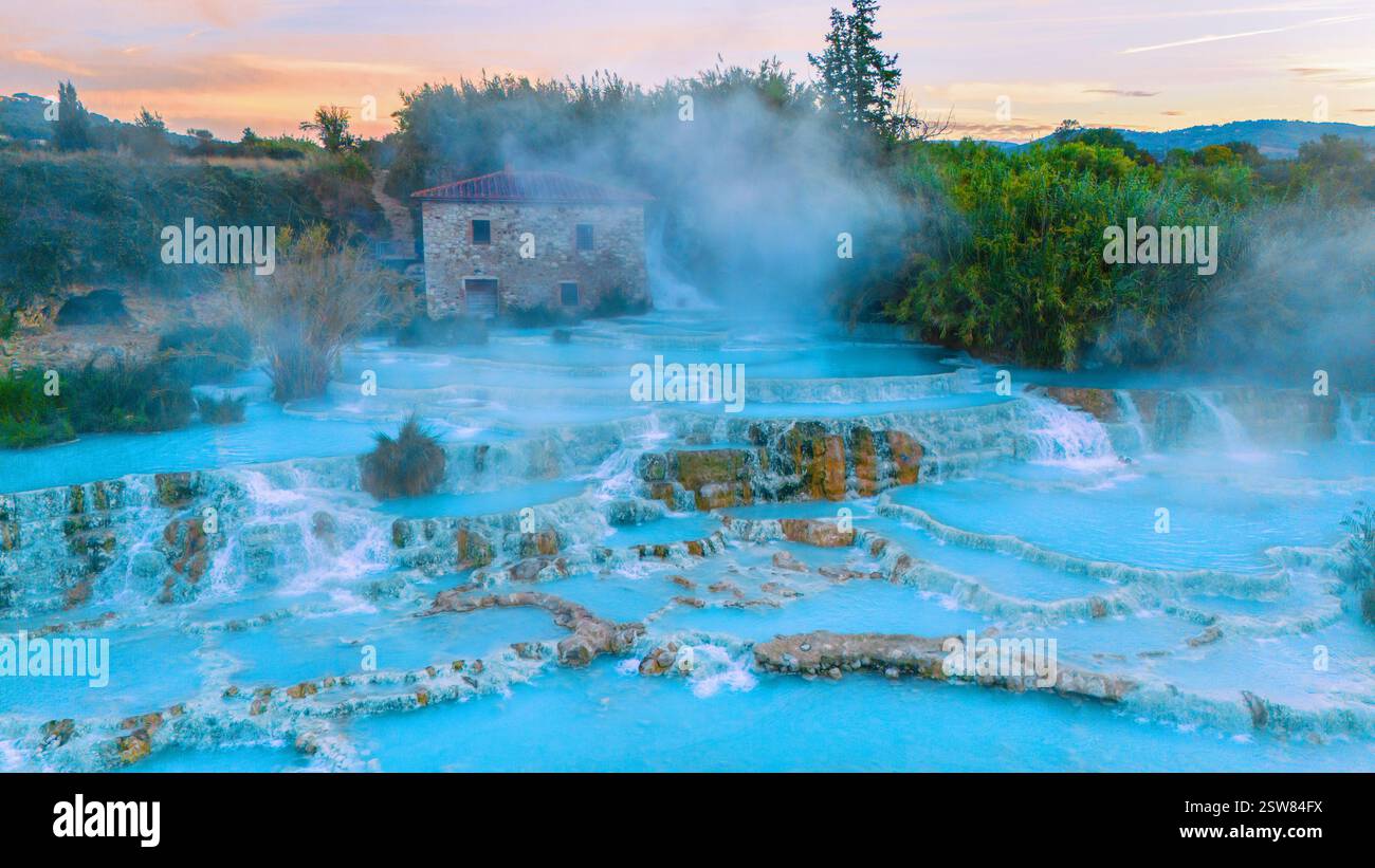 Steaming cascade over the ancient terraces of saturnia thermal baths hi ...