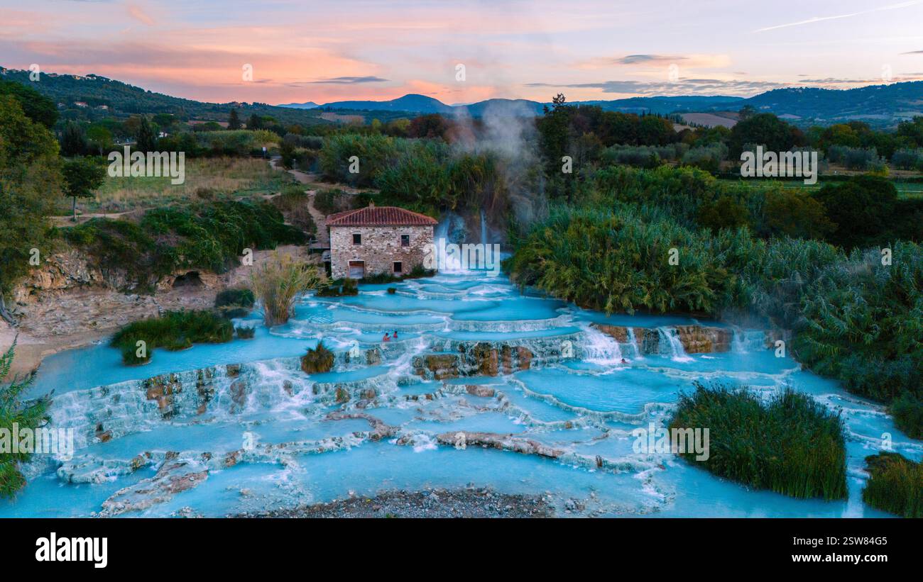Experience the natural beauty of Saturnia thermal baths at twilight in ...