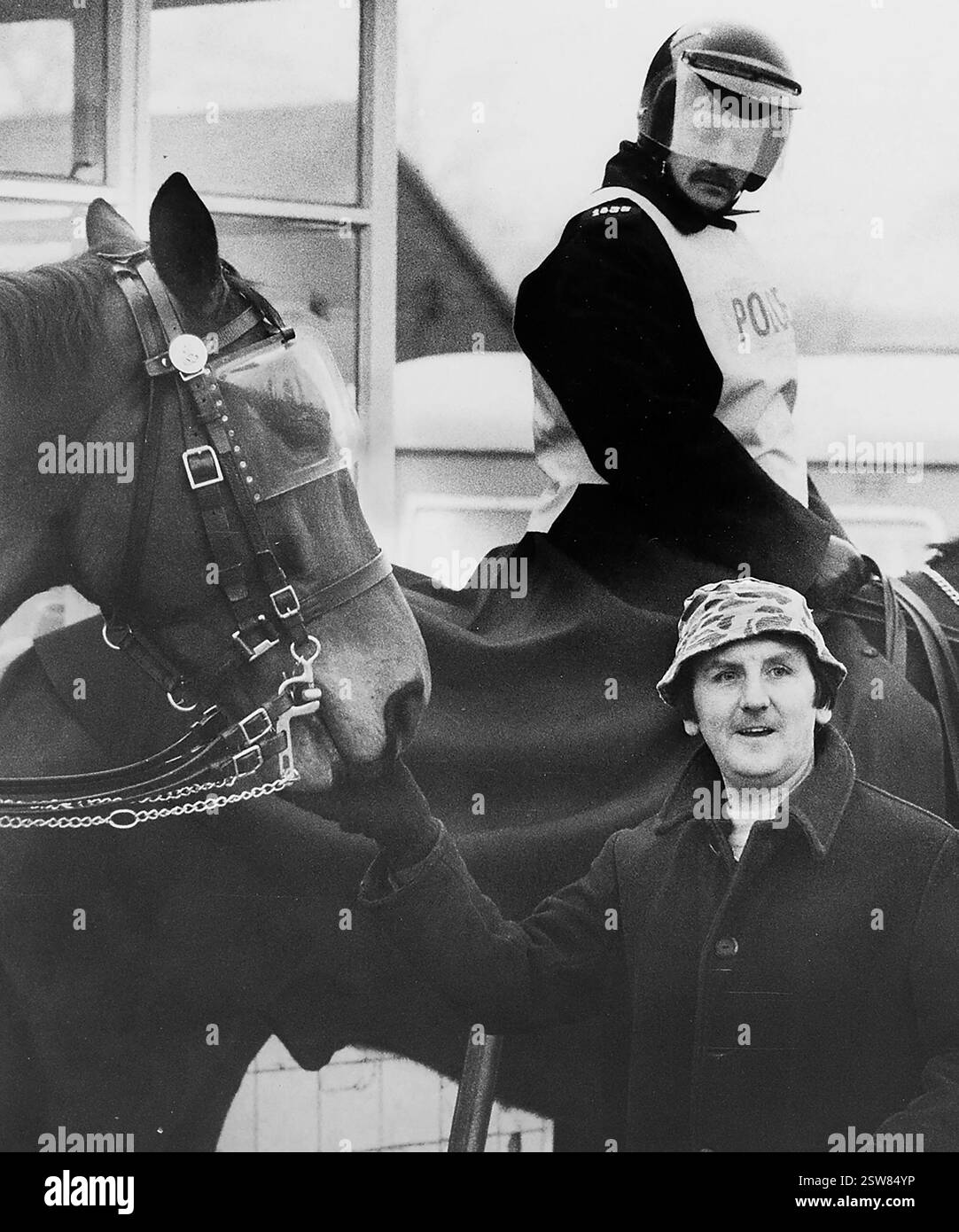 Miner strike Britain a picket at Lea Hall colliery strokes a police ...