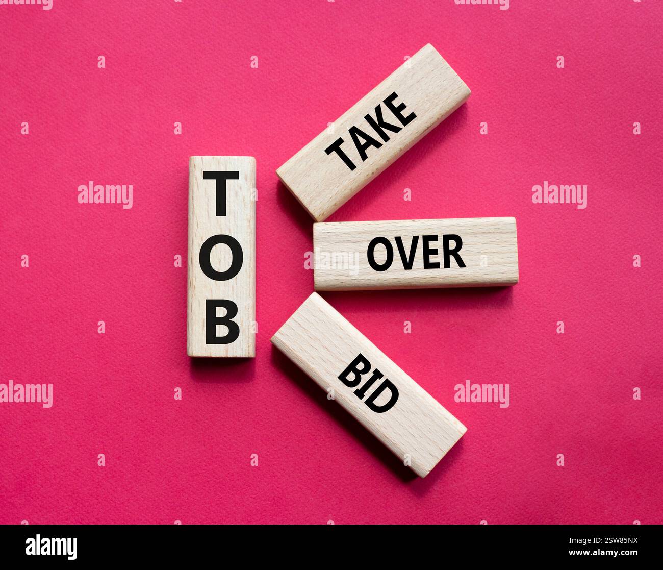 TOB - Take Over Bid. Wooden cubes with words TOB. Beautiful red ...