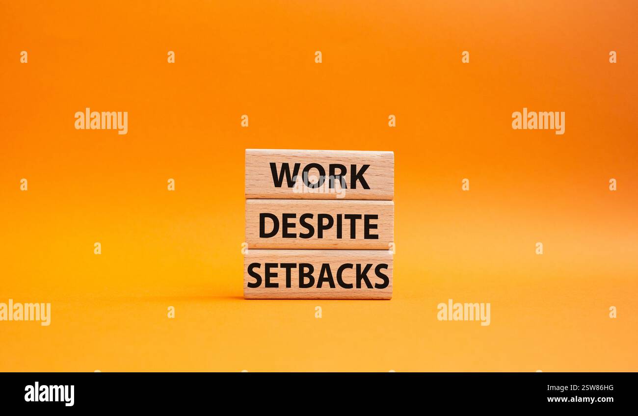 Work despite setbacks symbol. Wooden blocks with words Work despite ...