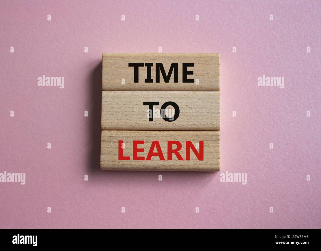 Time to learn symbol. Wooden blocks with words Time to learn. Beautiful ...