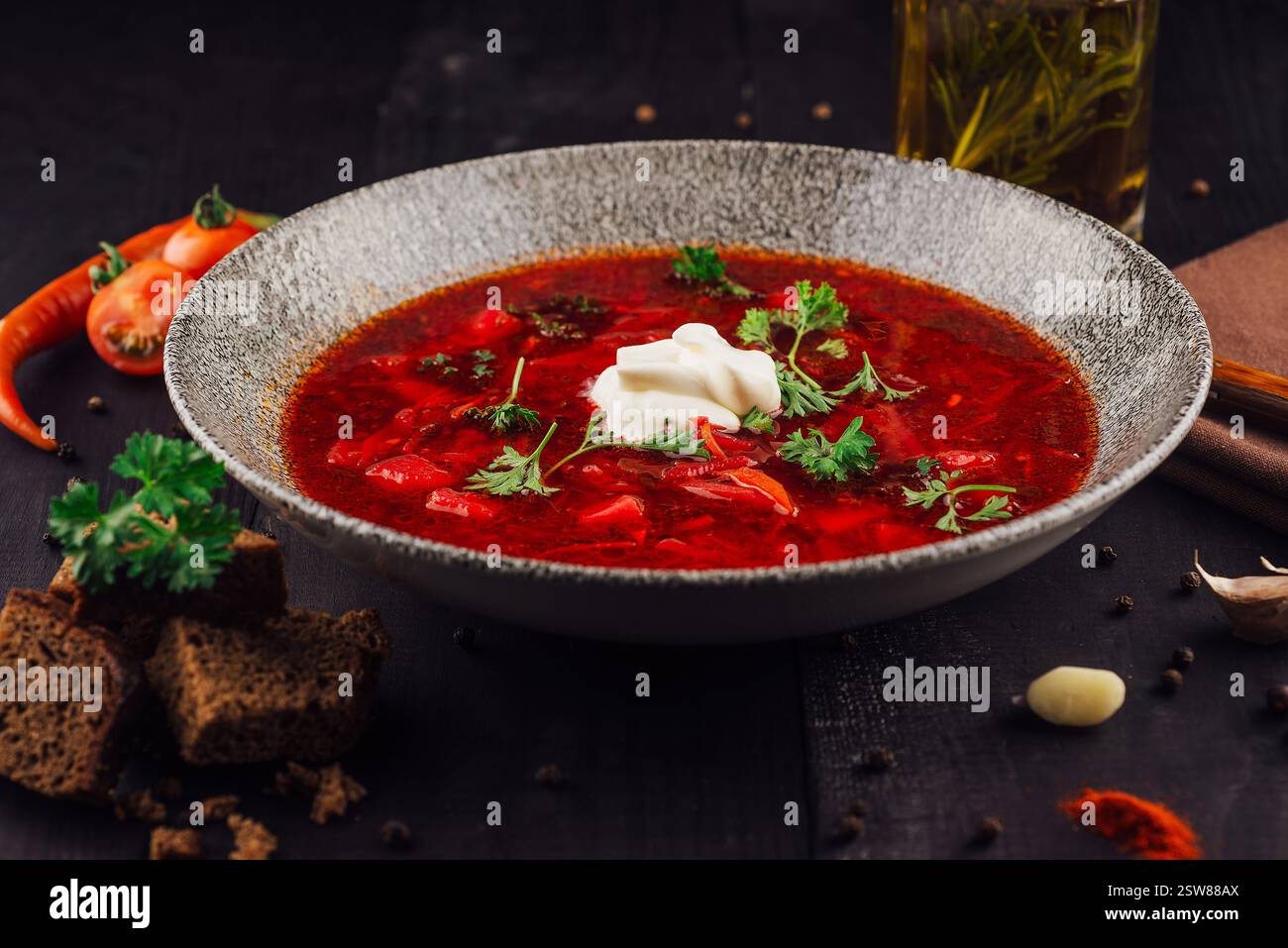Delicious bowl of borscht is served steaming hot with a dollop of sour ...