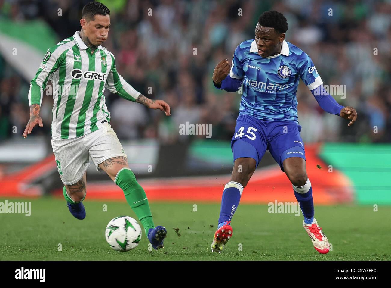 Hyllarion Goore of KAA Gant and Chimy Avila of Real Betis during the ...