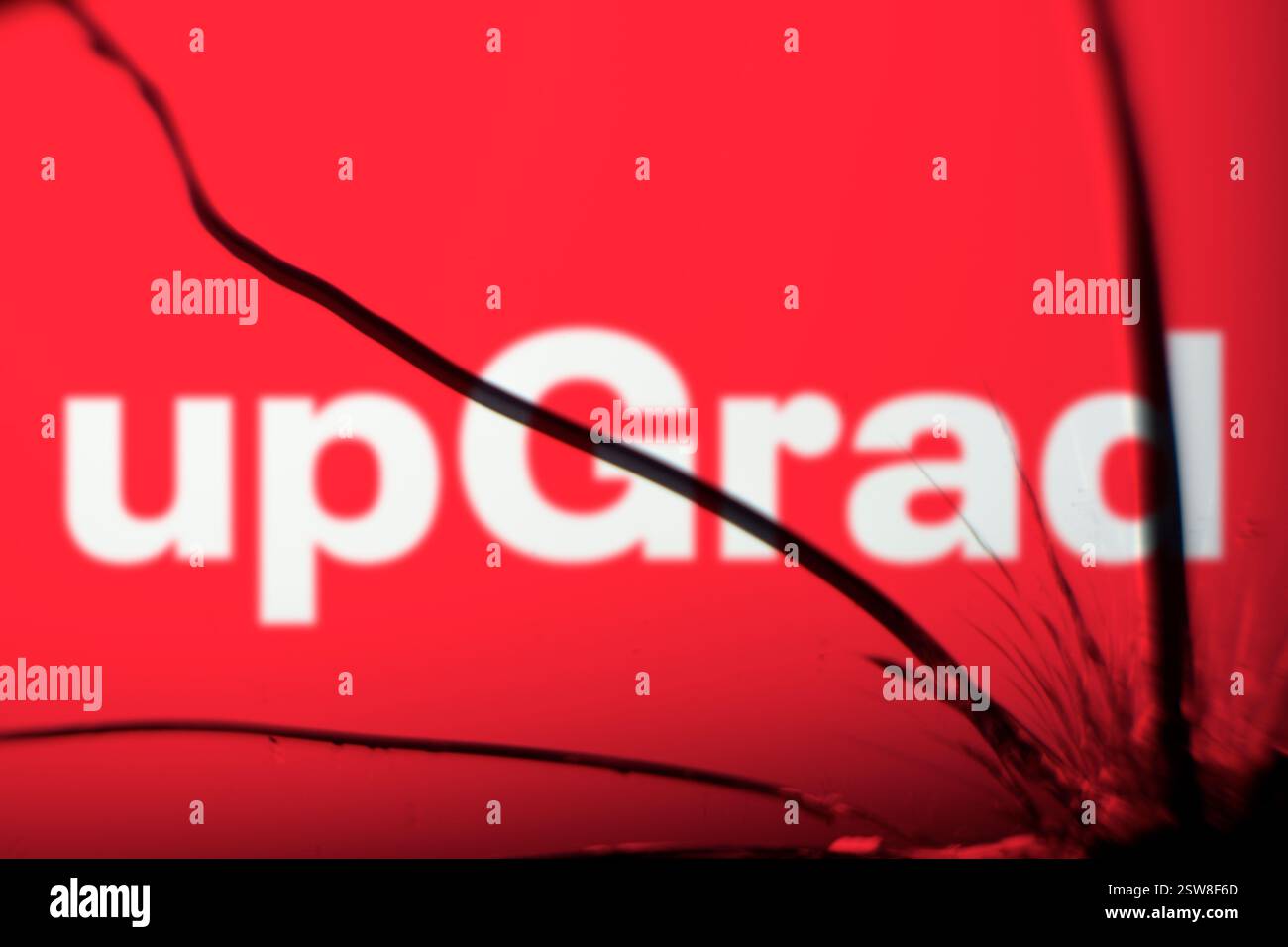 Upgrad logo is visible on the broken glass hi-res stock photography and ...