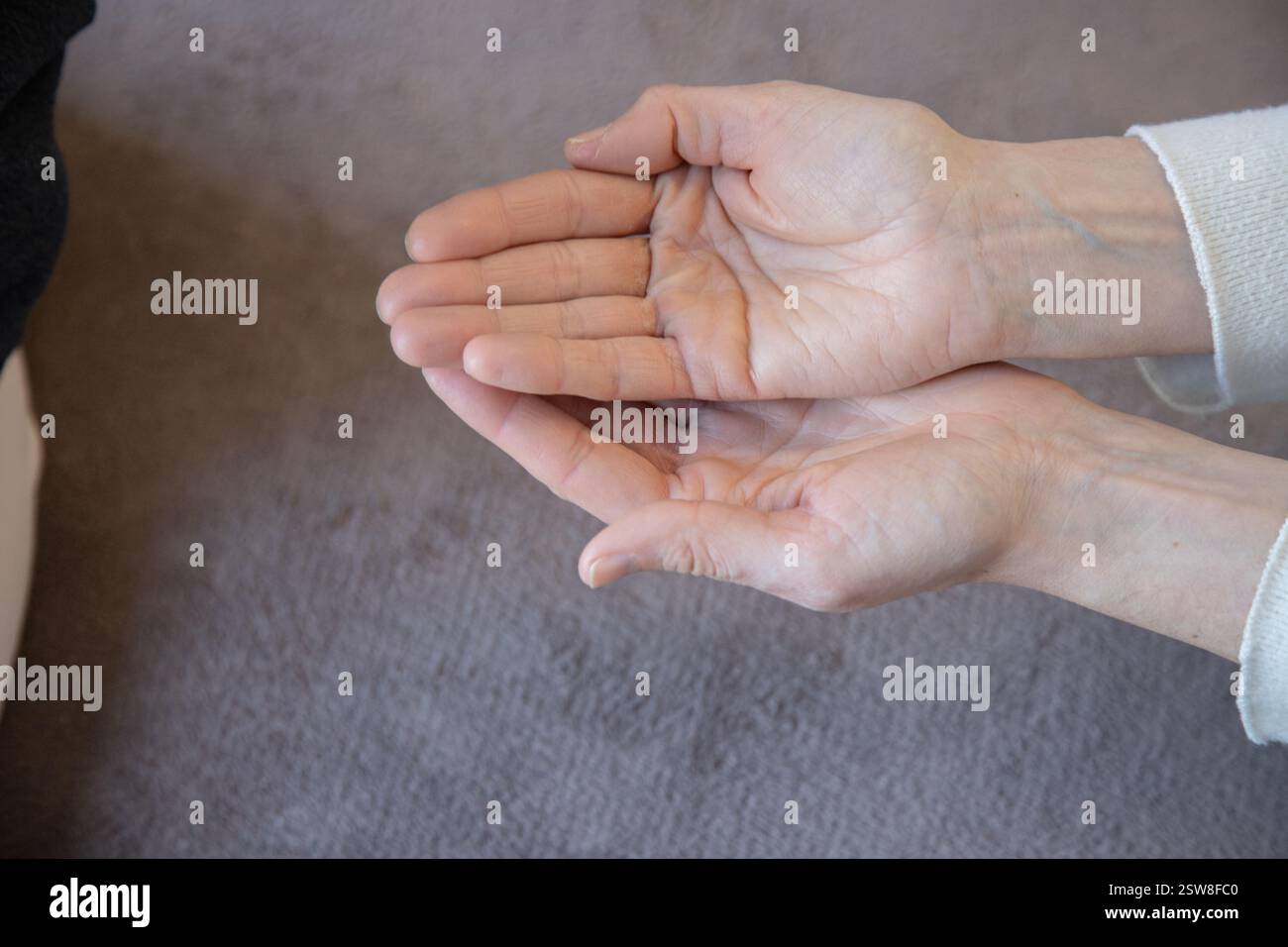 An adult's open hands symbolize giving, receiving, and connection Stock ...