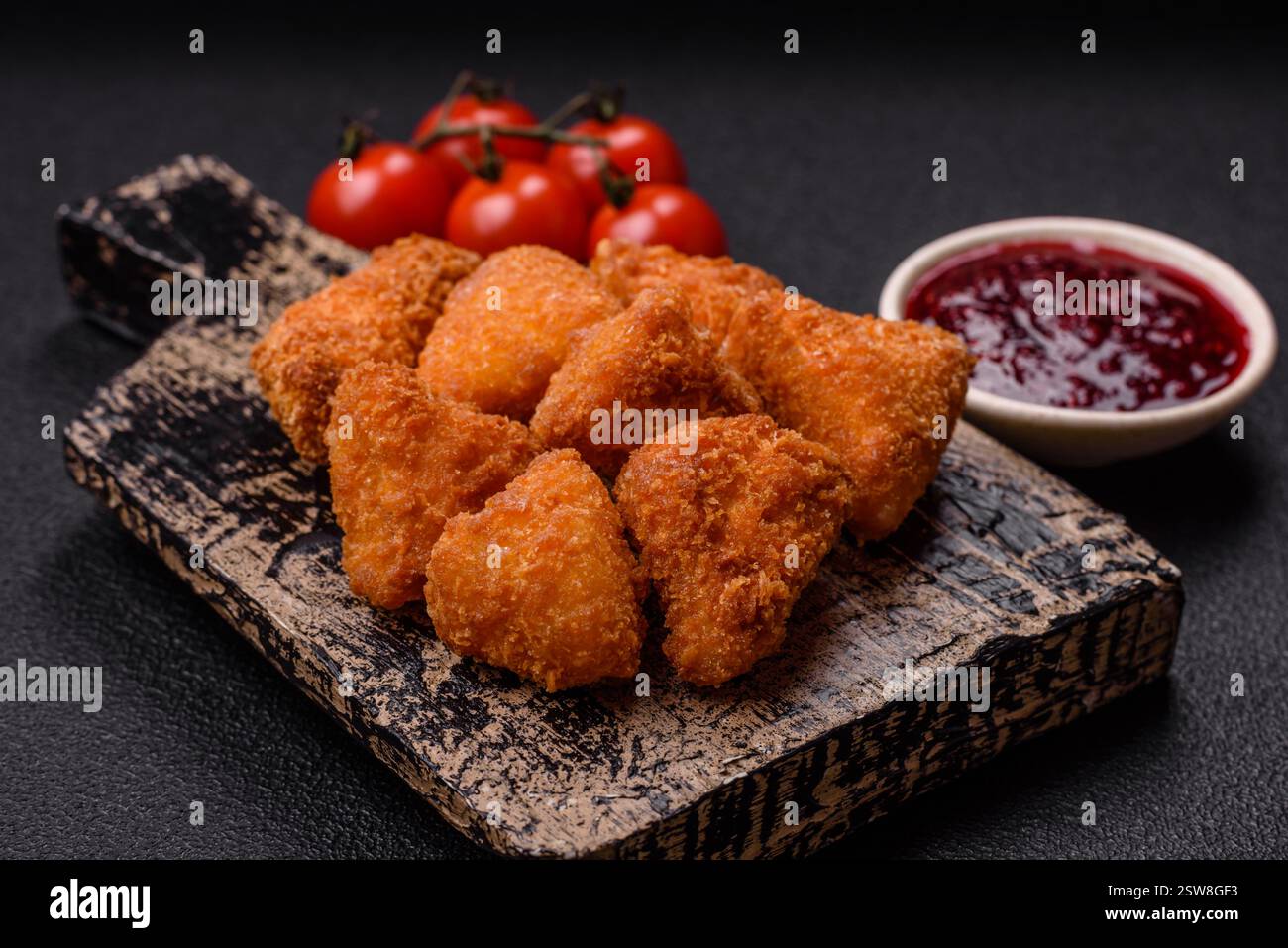Brie cheese or camembert fries in breading, fast food, takeaway Stock ...