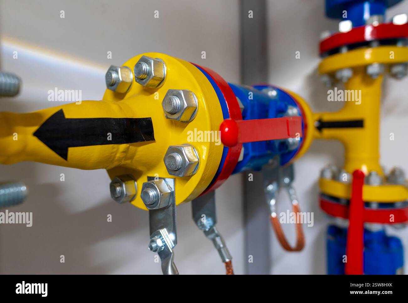 Natural gas pipeline with flanged connection and flow direction marking ...
