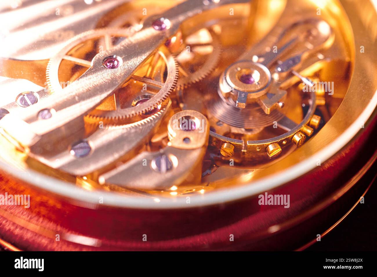 Delicate mechanics of a fine timepiece showcasing intricate gears and ...