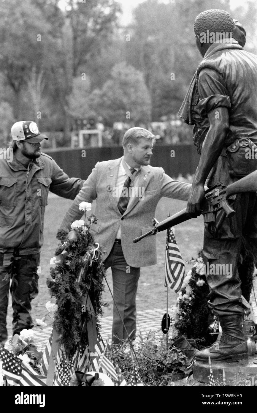 Medal of Honor recipient Sammy Lee Davis, right, reaches out to touch ...
