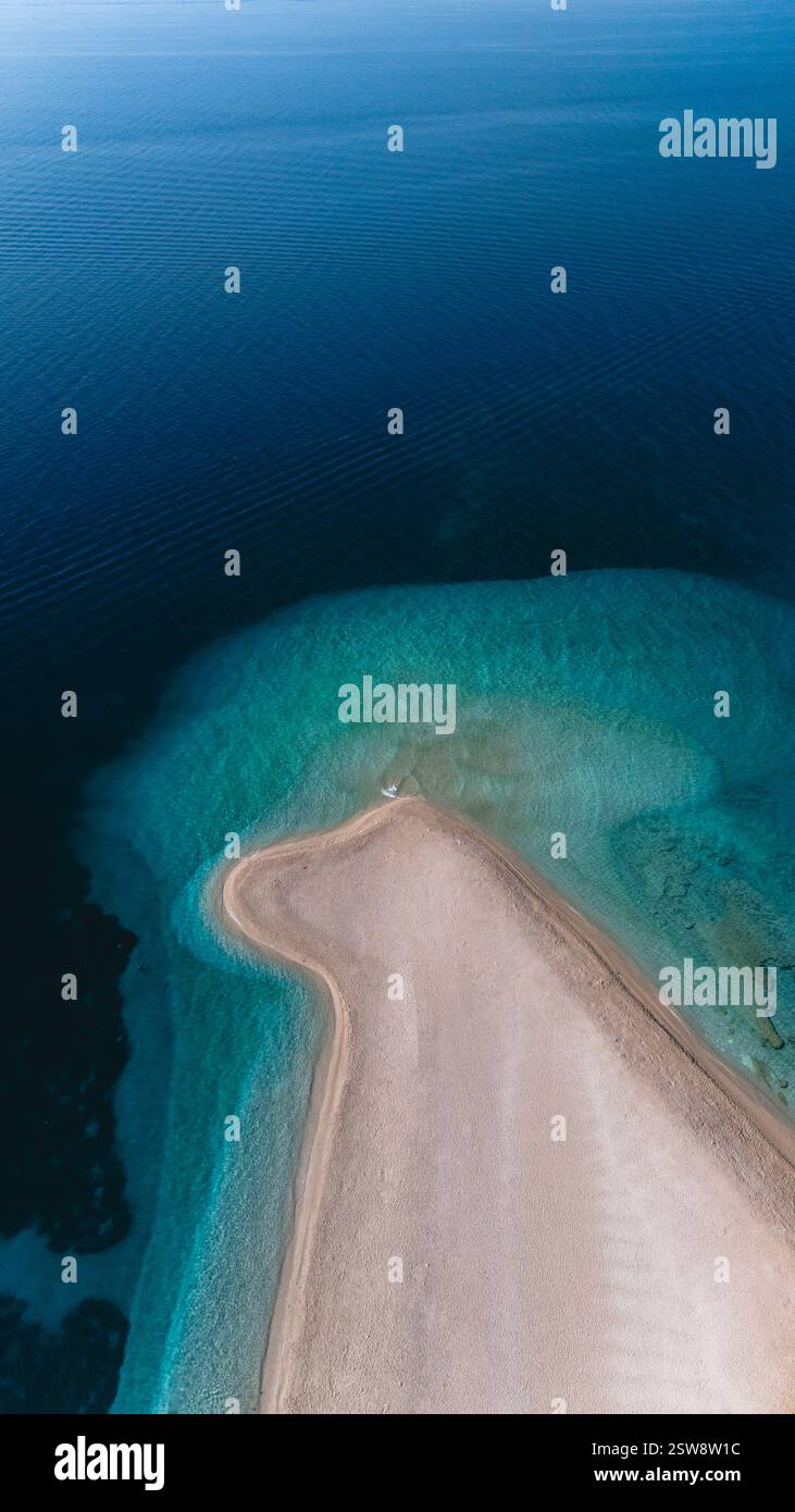 Aerial view of the stunning Zlatni Rat beach in Brac Island, Croatia on ...