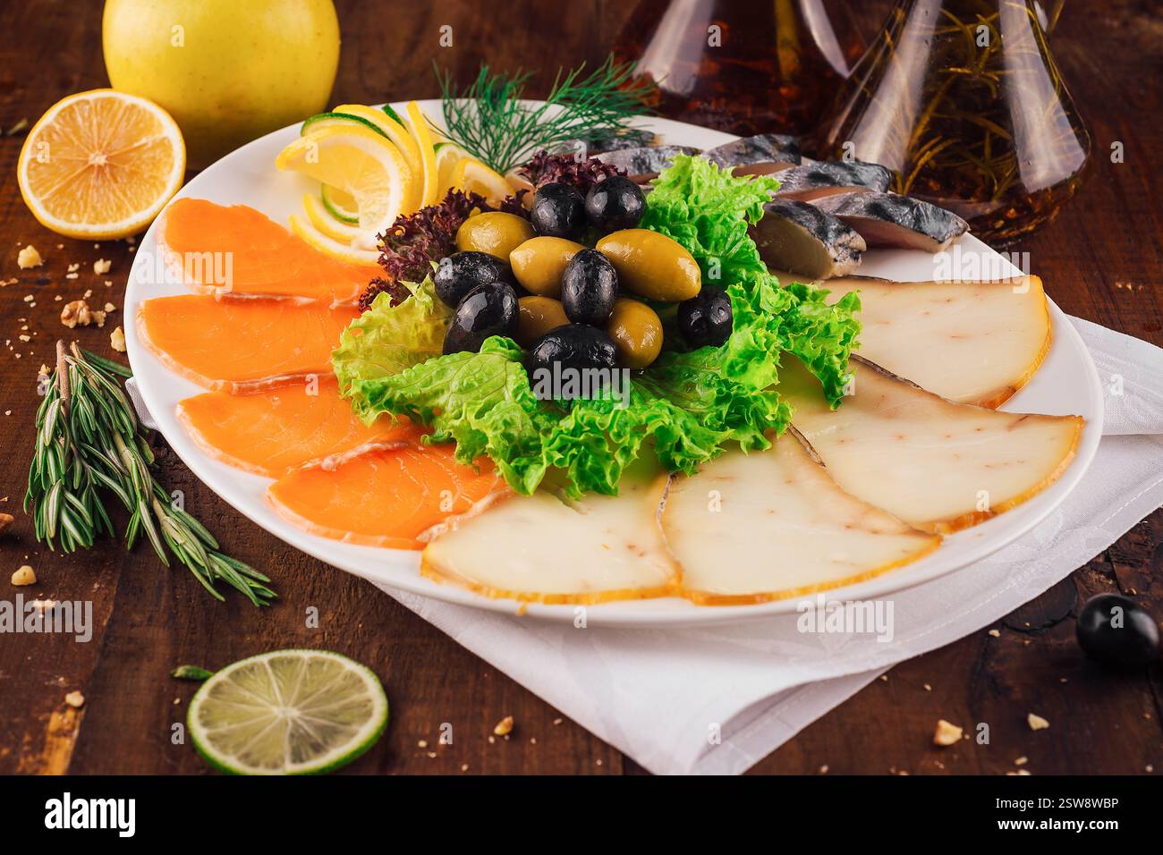 Sliced cold smoked fish platter with salmon and butterfish decorated ...
