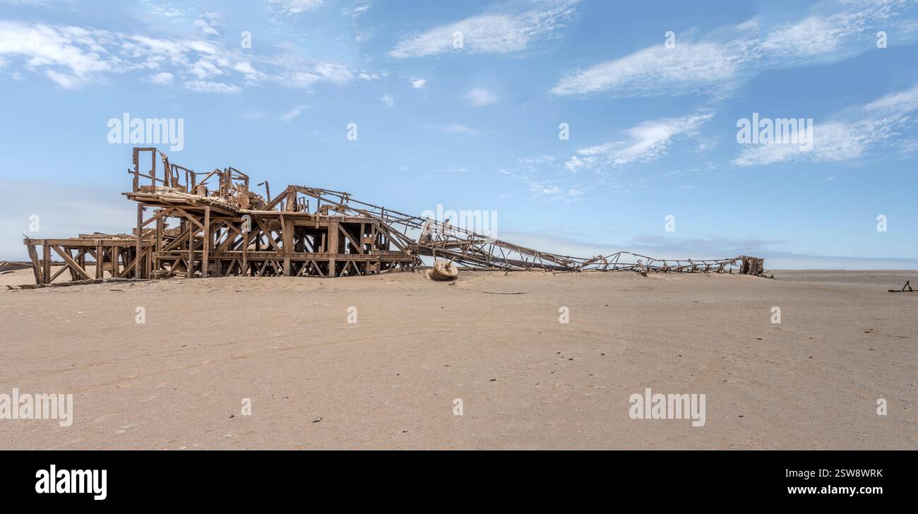 collapsed derrick of Drill Rig relic on desert sand, shot in bright ...