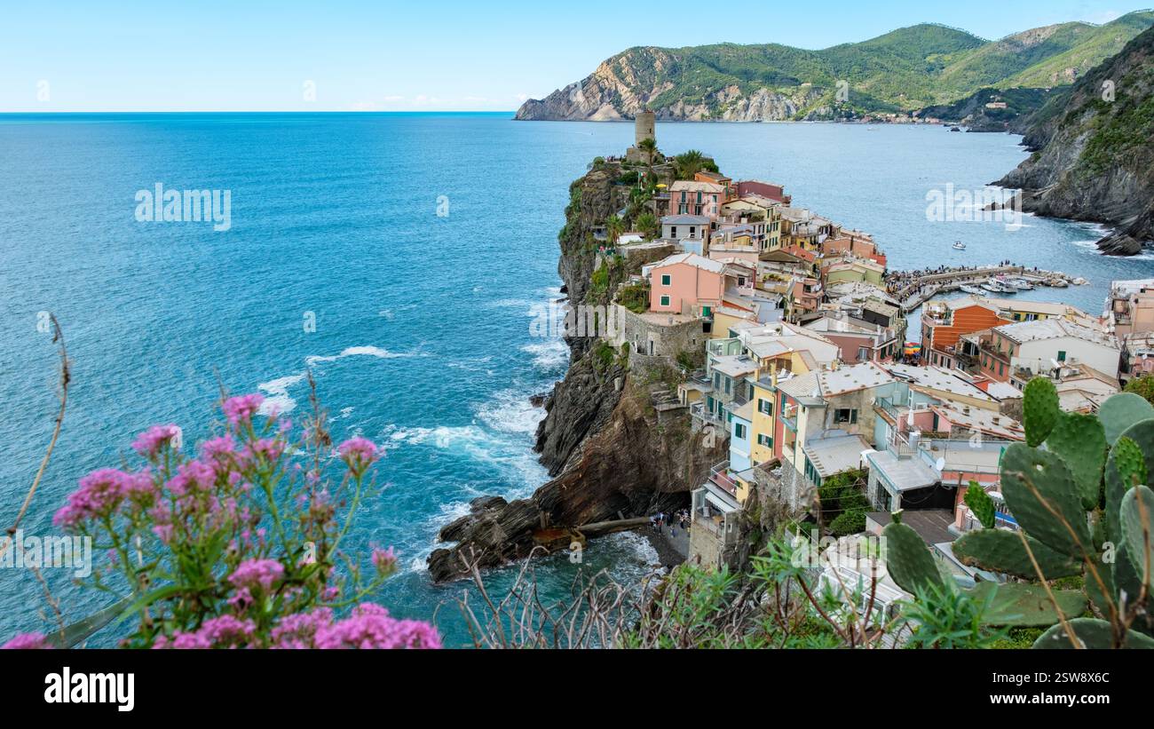 Colorful houses of cinque terre overlook the azure waters hi-res stock ...