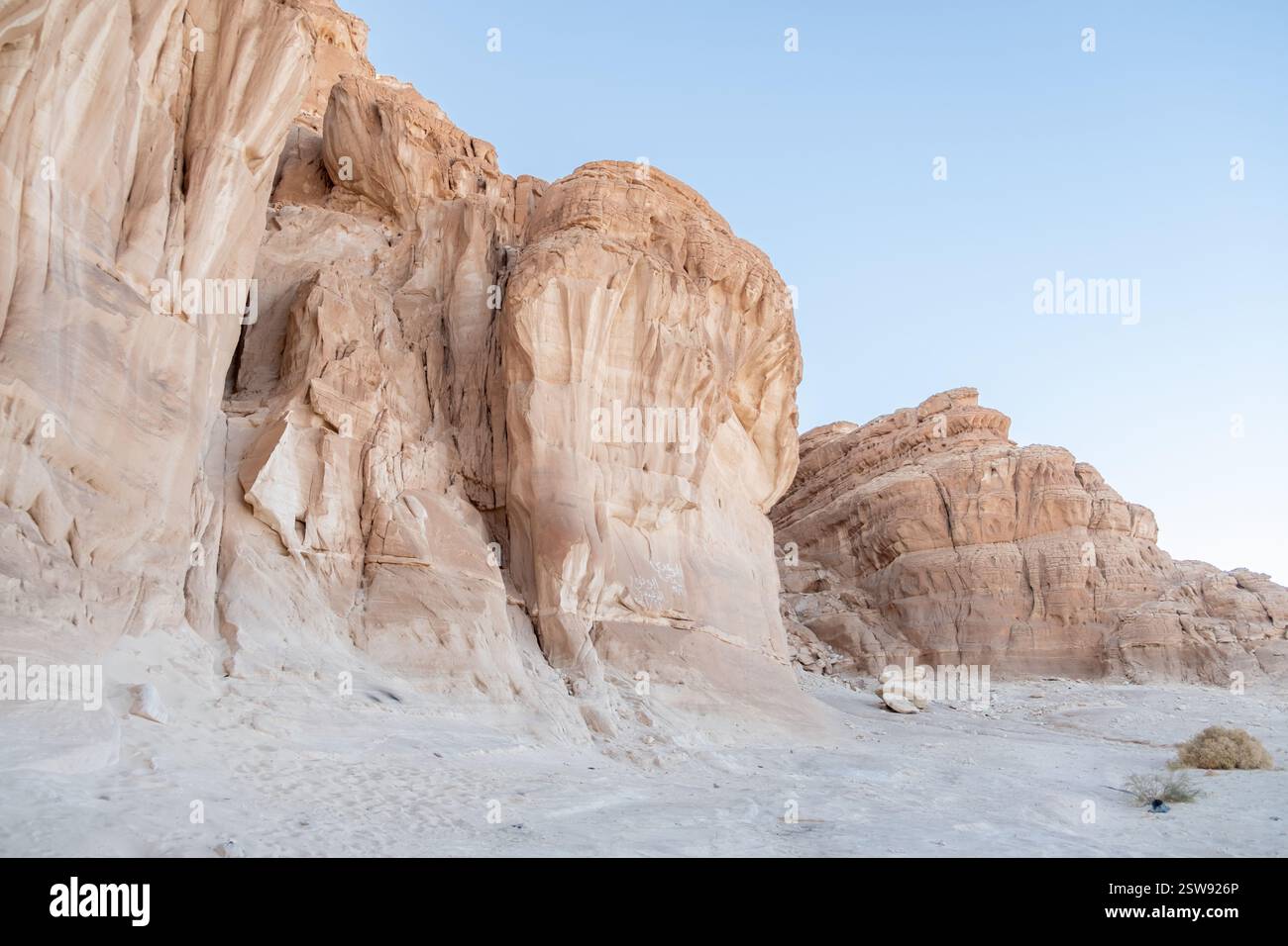 Natural rock formations rise gracefully against the clear sky in Sinai ...