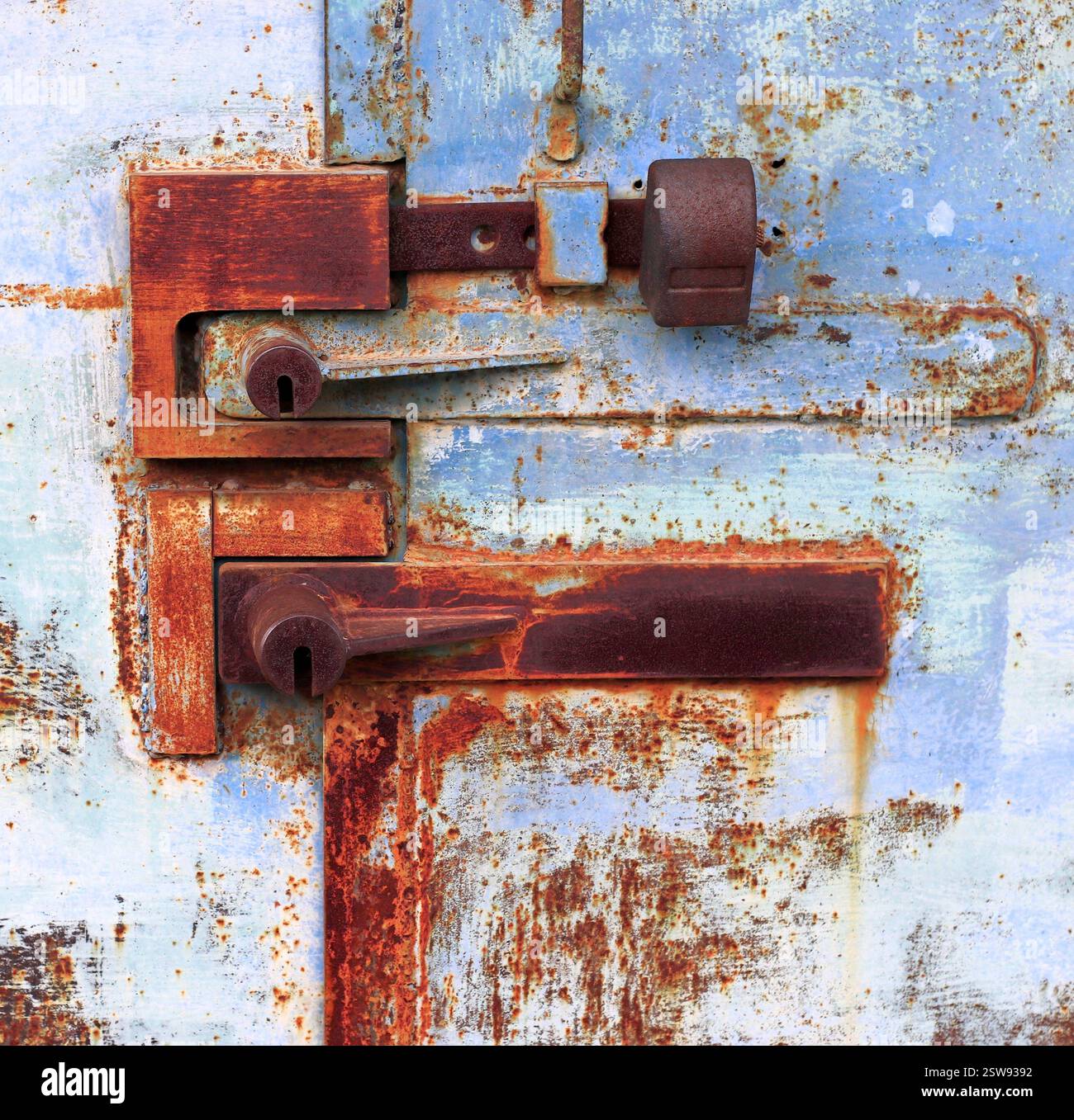 Rusted metal gate with a set of locks Stock Photo - Alamy