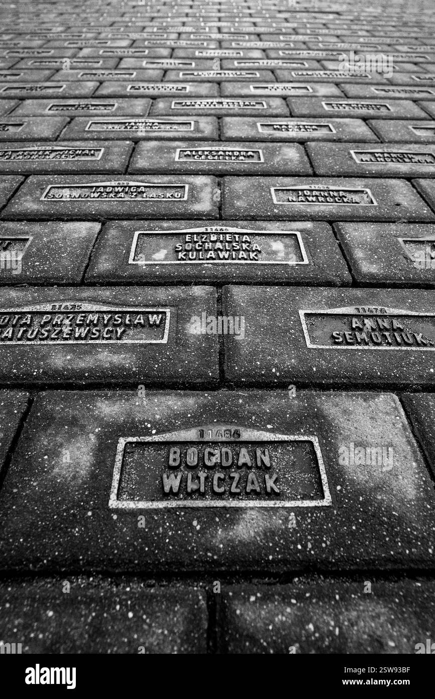 Cobblestone street with engraved Holocaust victims names in Lodz Stock ...