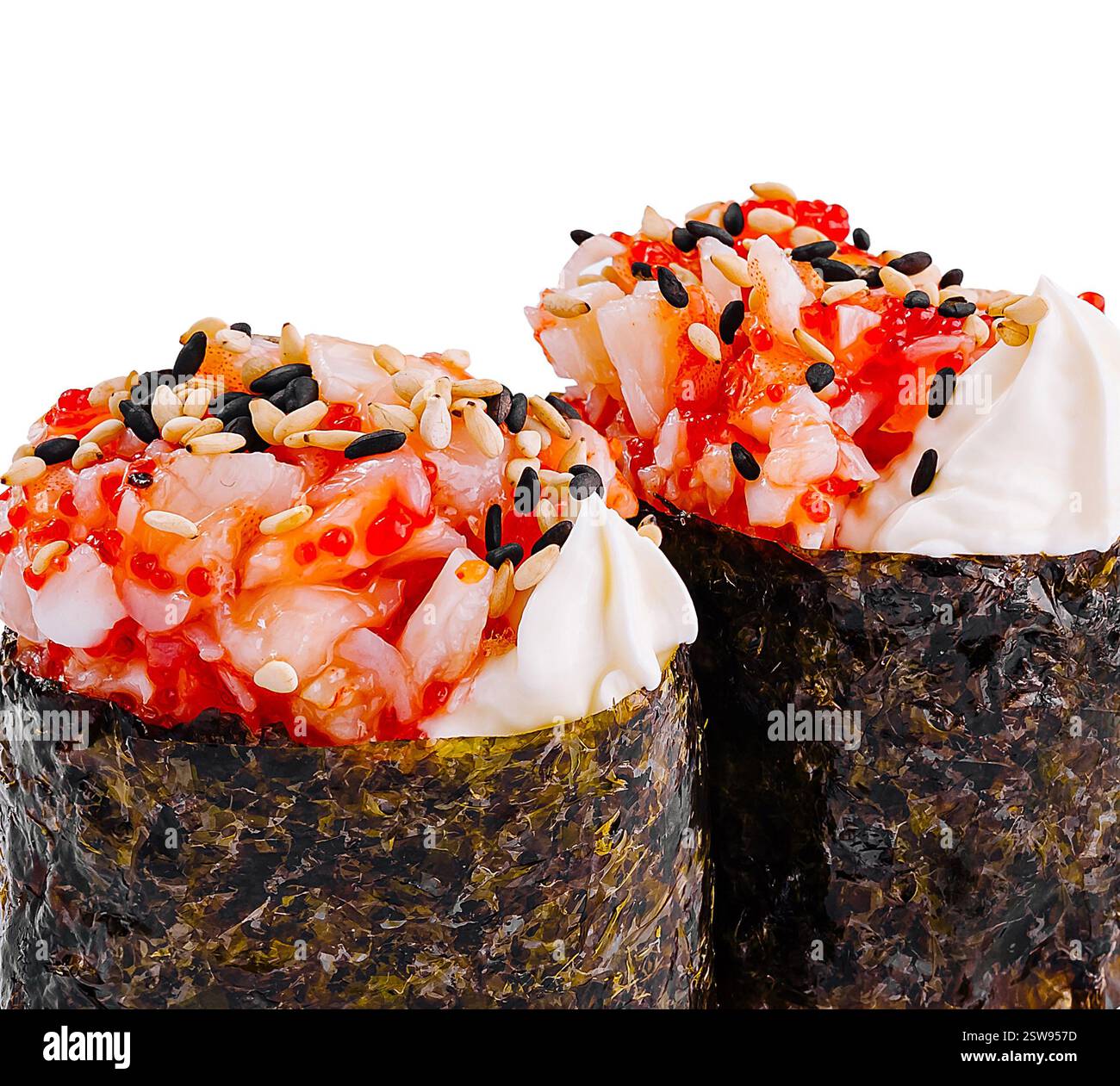 Two gunkan maki sushi rolls topped with tobiko caviar, sesame and spicy ...
