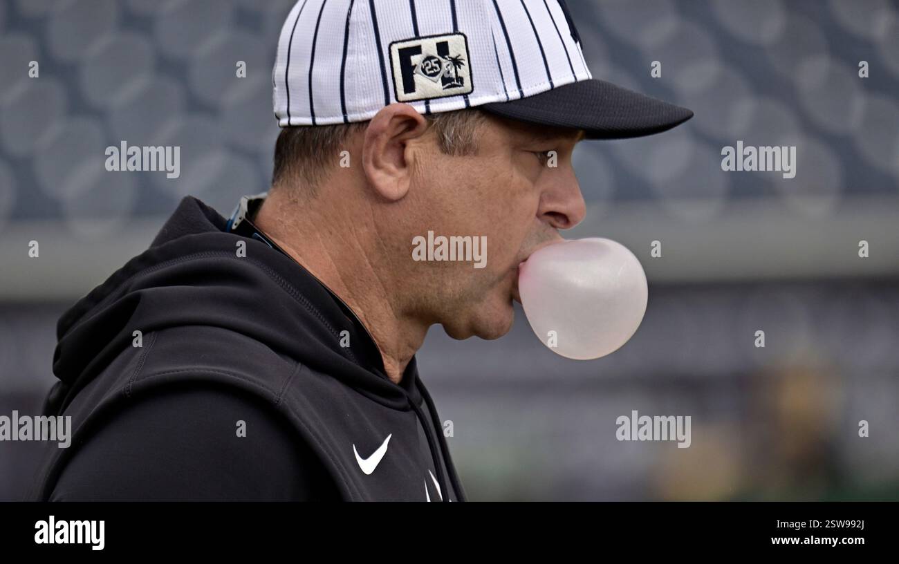 New York Yankees manager Aaron Boone blows a bubble during workouts at ...
