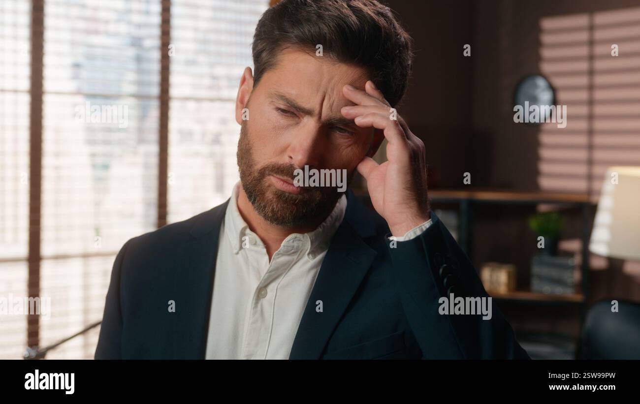 Portrait in office thinking business middle-aged Caucasian man businessman worker feeling bad ...