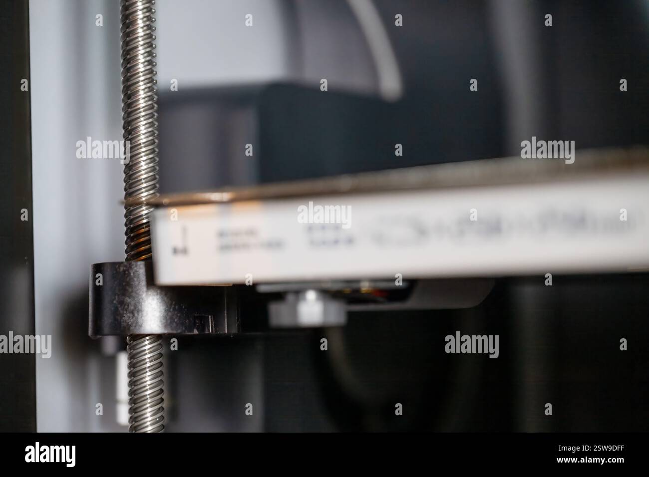 Selective focus on a 3d printer height screw used to change bed ...