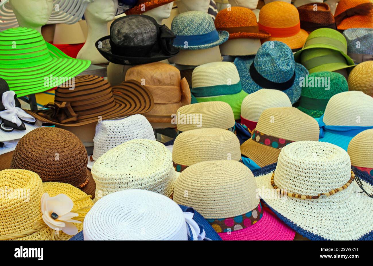 Female colorful stylish straw hats sold outside on a market stall Stock ...
