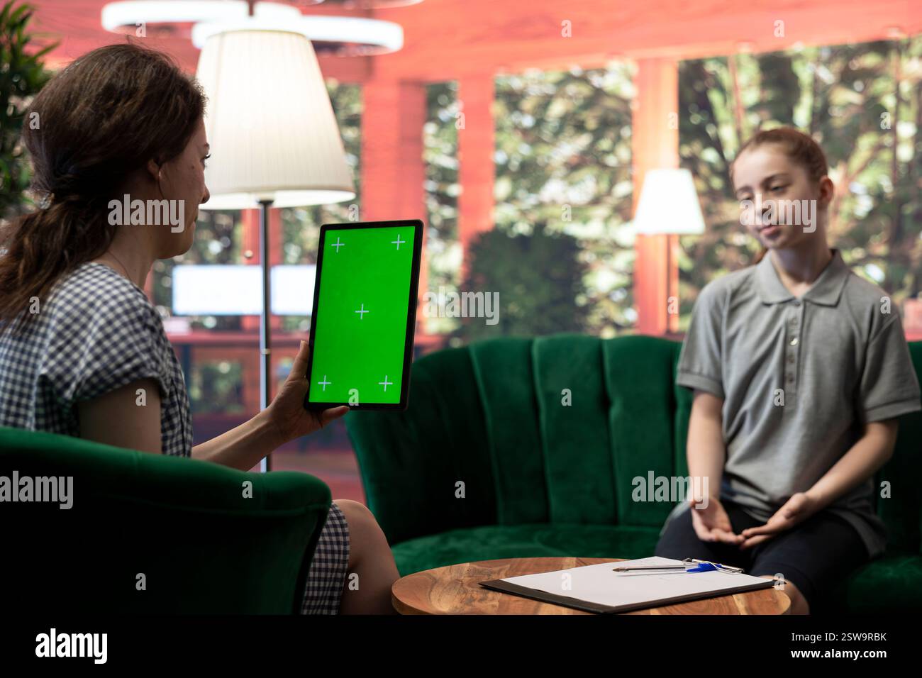 Teenager undergoing therapy for depression next to isolated chroma key ...