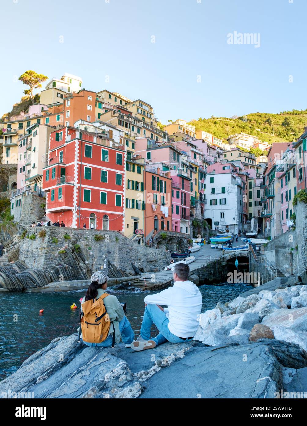 Exploring the colorful coast of Cinque Terre at sunset with charming ...