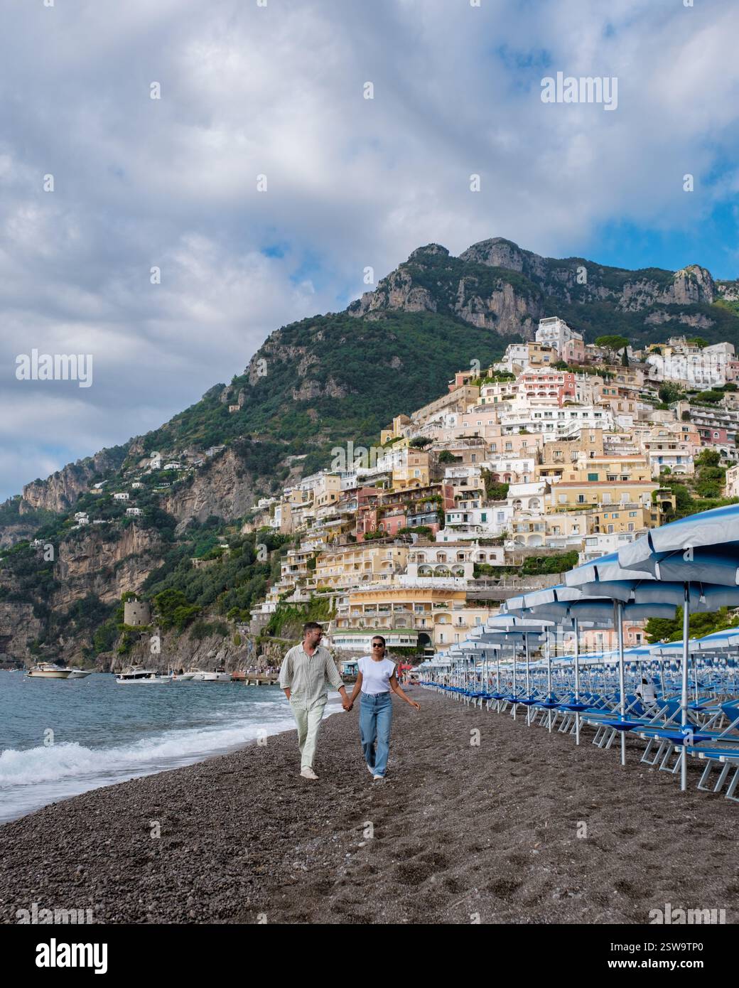 A romantic stroll along the pebble beach of Positano on the Amalfi ...