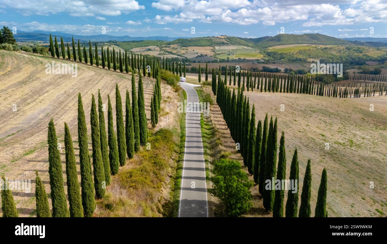 Breathtaking Tuscan countryside with majestic cypress trees lining a ...