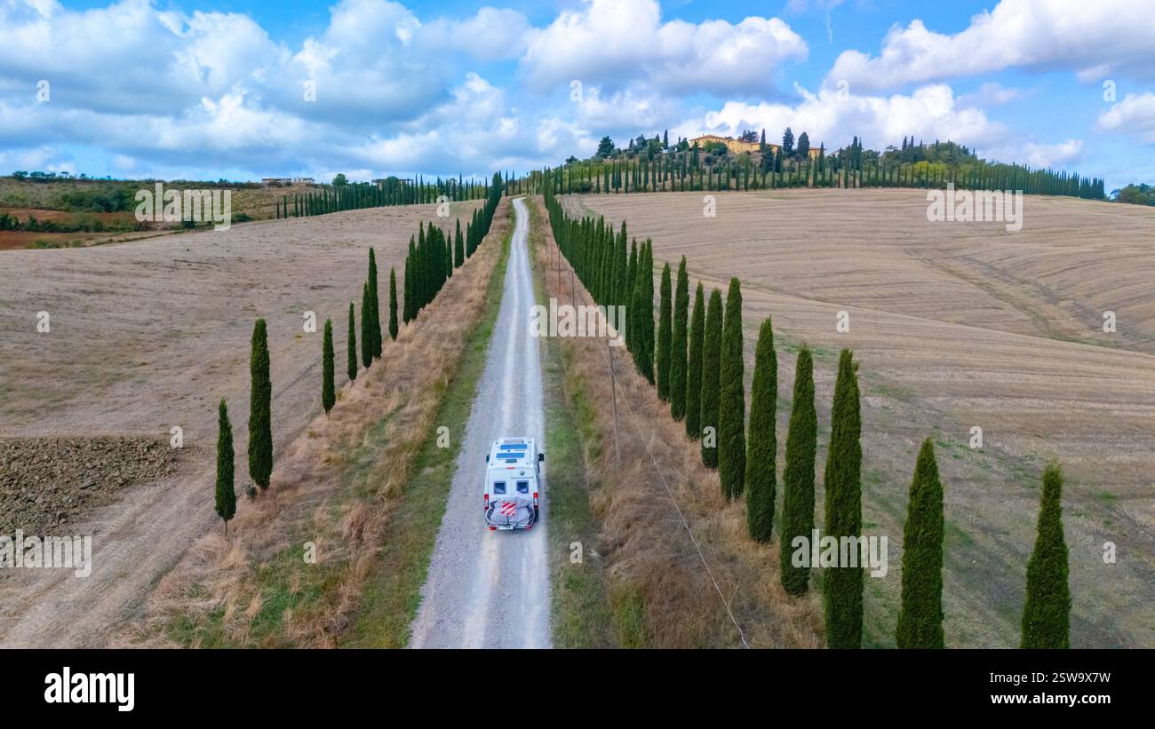 A scenic drive through Tuscany's cypress-lined roads at golden hour ...