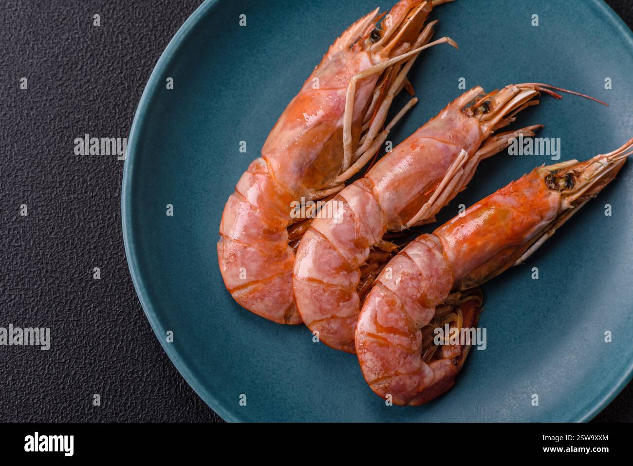 Boiled tiger prawns with salt, spices, herbs and vegetables Stock Photo ...