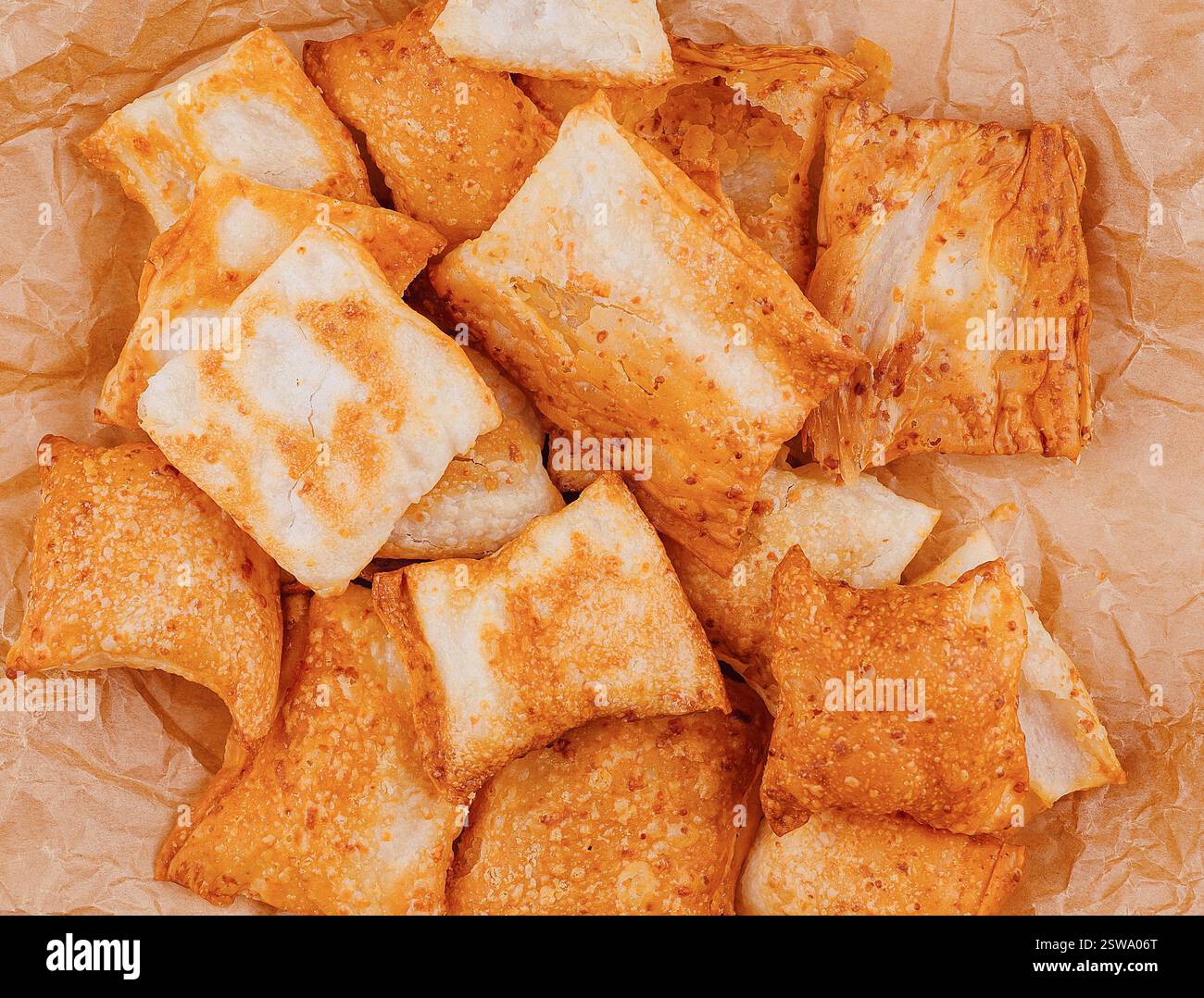 Delicious puff pastry squares laying on baking paper Stock Photo - Alamy