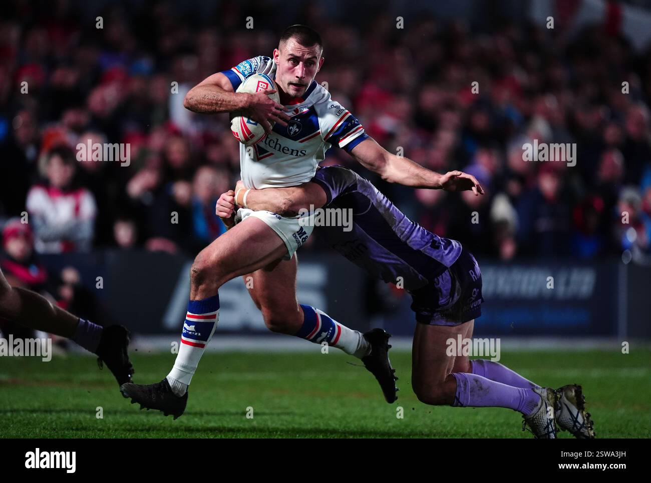 Wakefield Trinity's Oliver Pratt is tackled by Hull Kingston Rovers ...