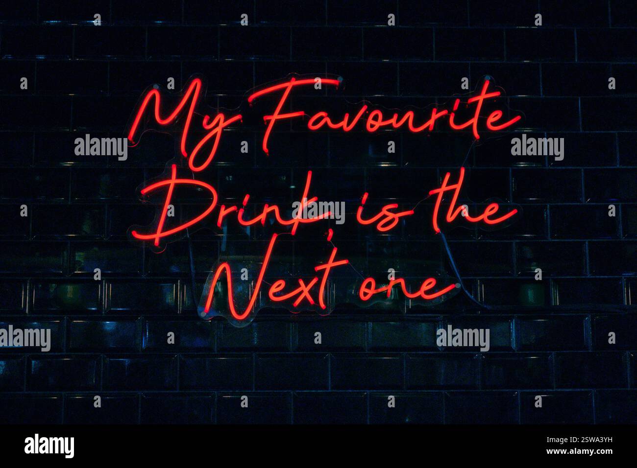A bold neon sign glows in the night, setting the perfect vibe with a ...