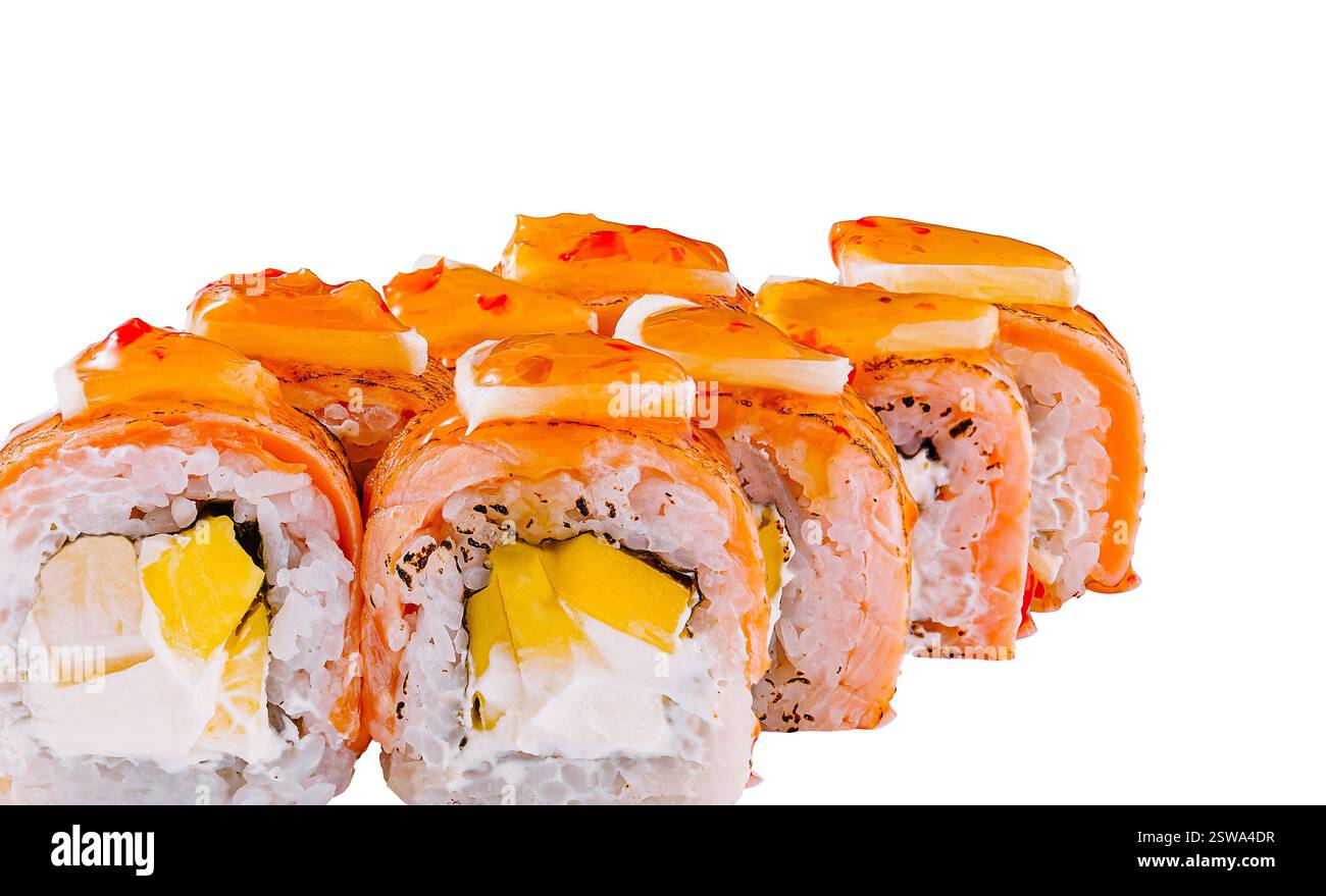 Sushi rolls with salmon, mango, cream cheese and sauce standing in line ...