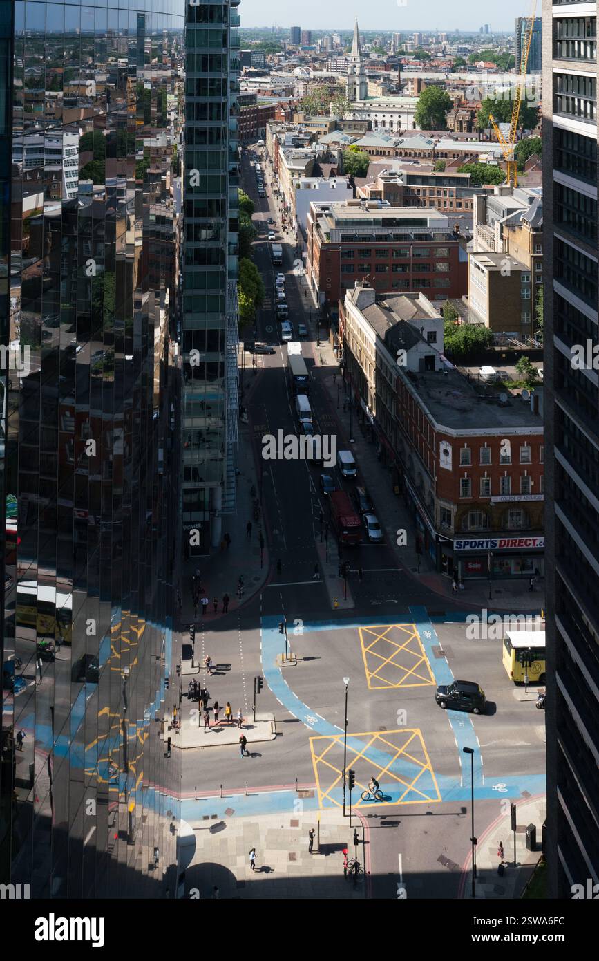 Aldgate Commercial Street, London. Reflections of the city are seen in ...