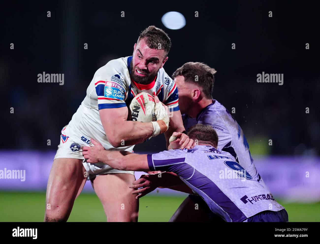 Wakefield Trinity's Mike McMeeken is tackled by Hull Kingston Rovers ...