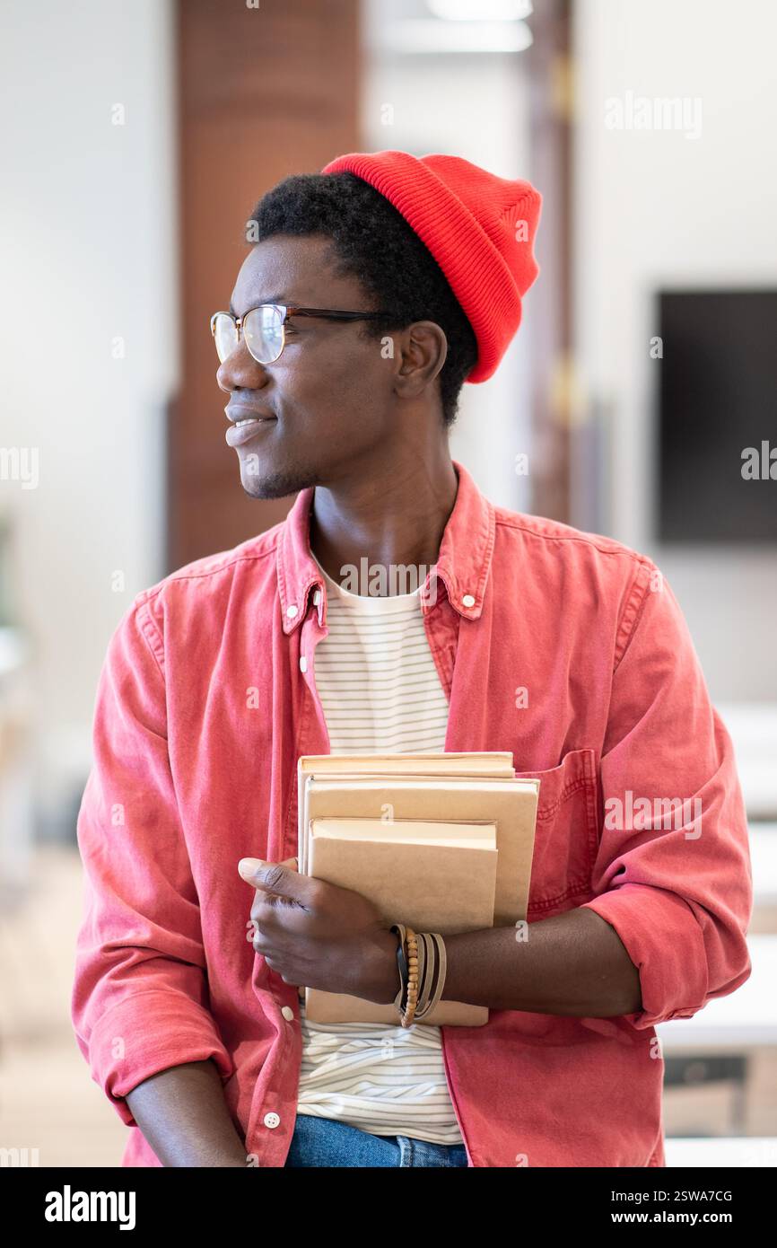 Young happy African American man university teacher sitting in ...
