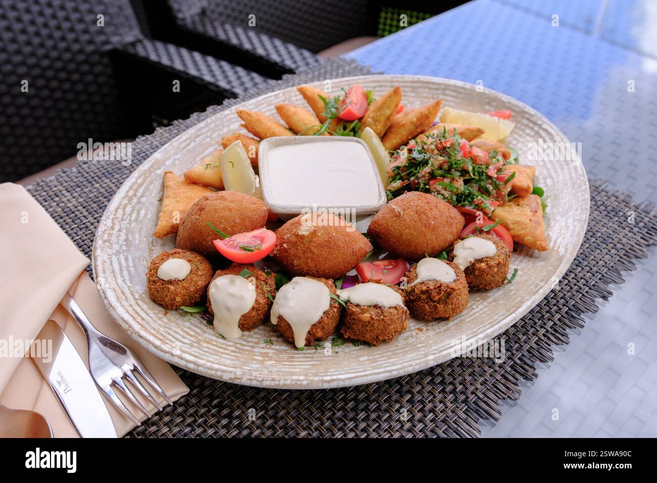 A platter of assorted Middle Eastern appetizers including fried ...
