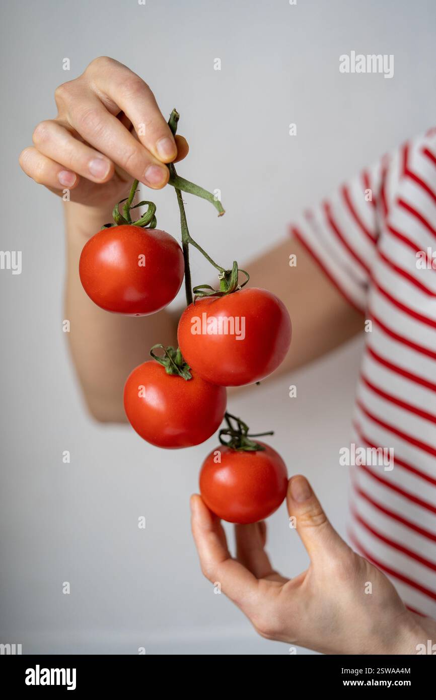 Woman salad cherry tomatoes vertical hi-res stock photography and images - Alamy