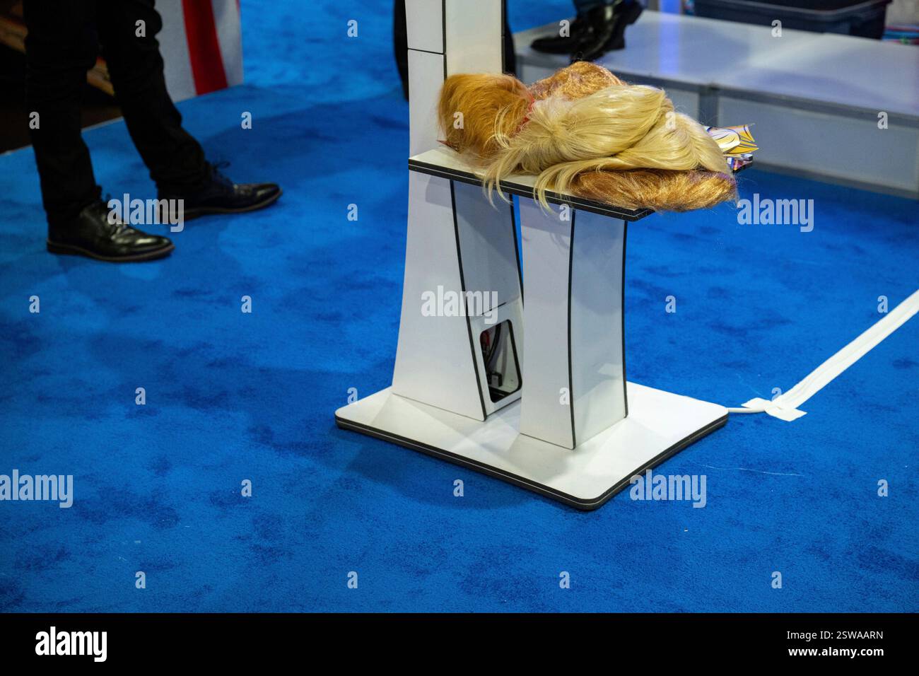 â Donald Trumpâ wigs are used as props at a photo booth at the 2025 ...