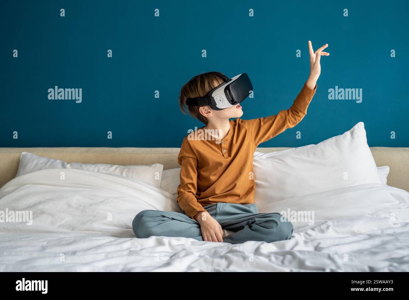 Inspired interested kid boy experience virtual reality goggles ...